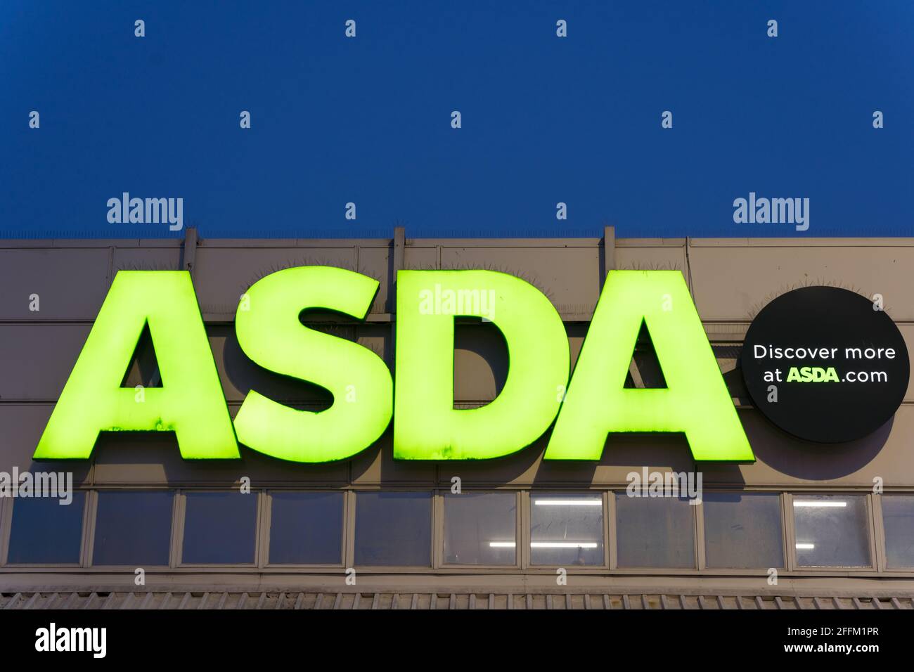 ASDA logo in green lettering fixed to the top of store entrance, London ...