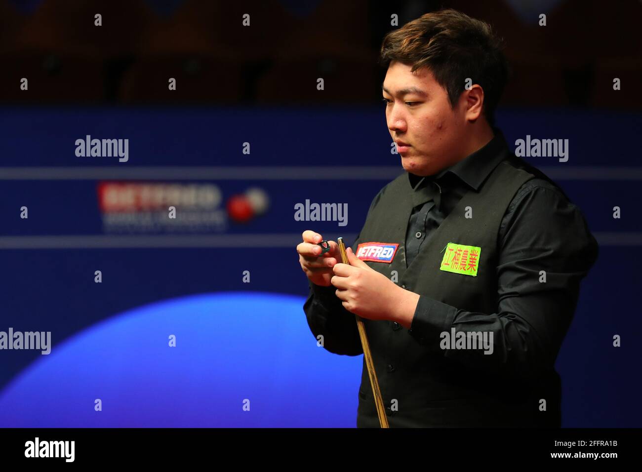 Sheffield, Britain. 24th Apr, 2021. China's Yan Bingtao competes during ...
