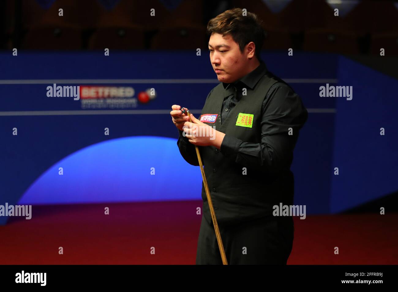 Sheffield, Britain. 24th Apr, 2021. China's Yan Bingtao competes during ...