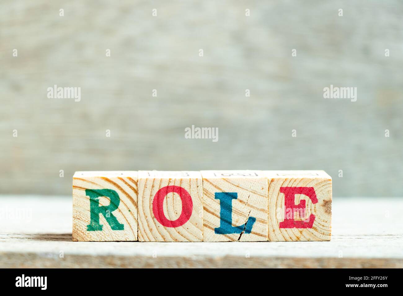 Alphabet letter block in word role on wood background Stock Photo - Alamy