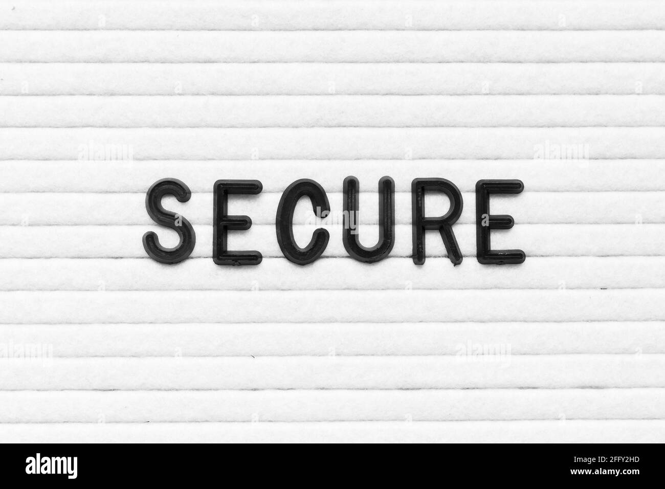 Black color letter in word secure on white felt board background Stock ...