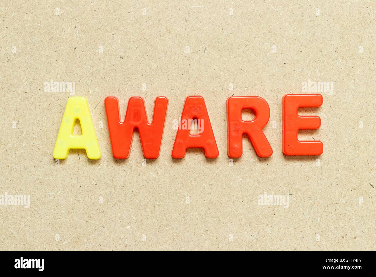 Color alphabet letter with word aware on wood background Stock Photo ...
