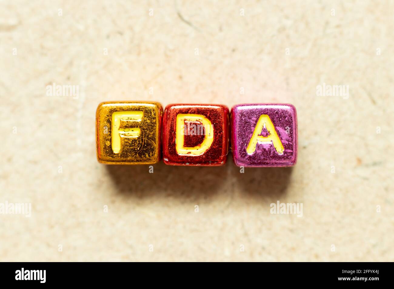Metallic color alphabet letter block in word FDA (abbreviation of food ...