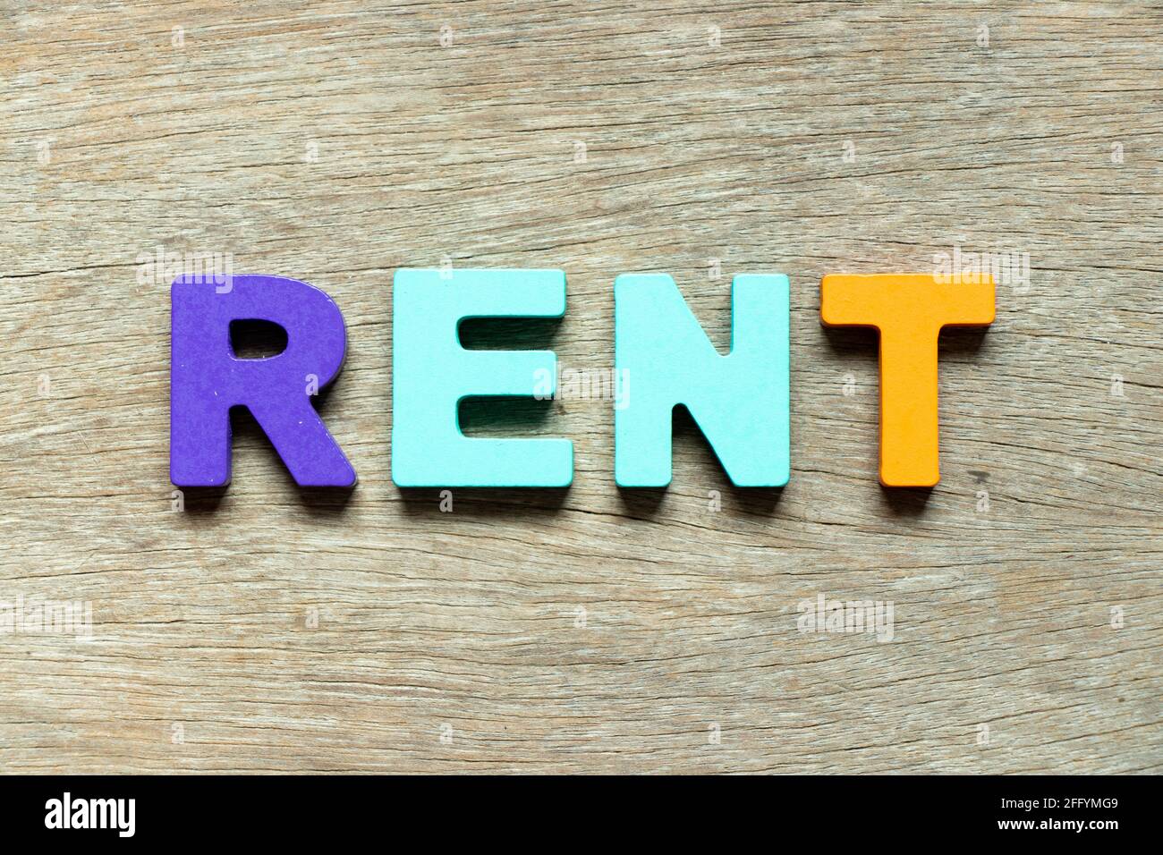 Color alphabet letter in word rent on wood background Stock Photo - Alamy