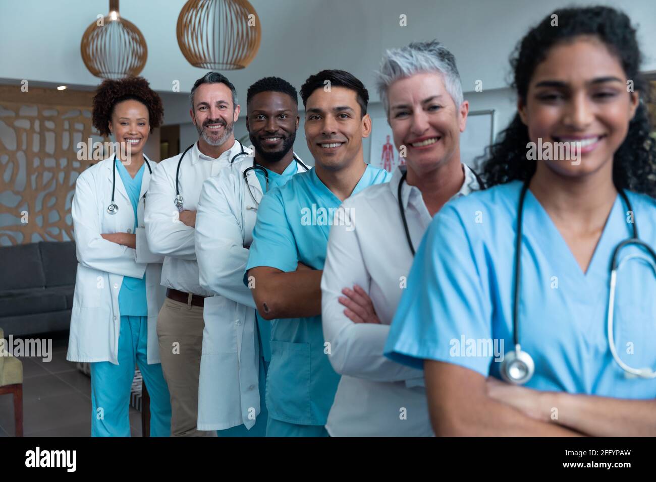 Portrait of group of diverse male and female doctors standing in ...
