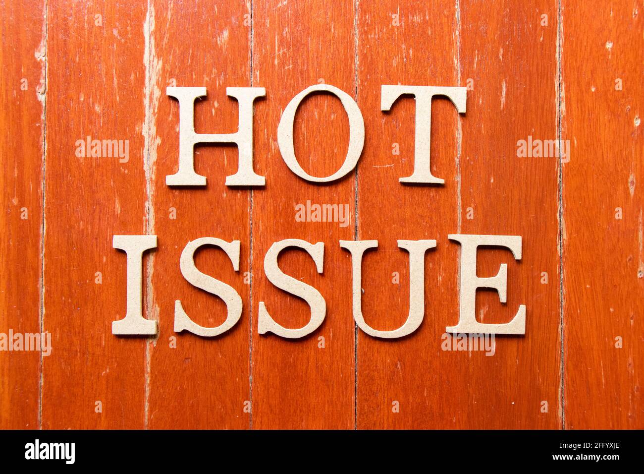 Alphabet letter in word hot issue on old red color wood plate ...
