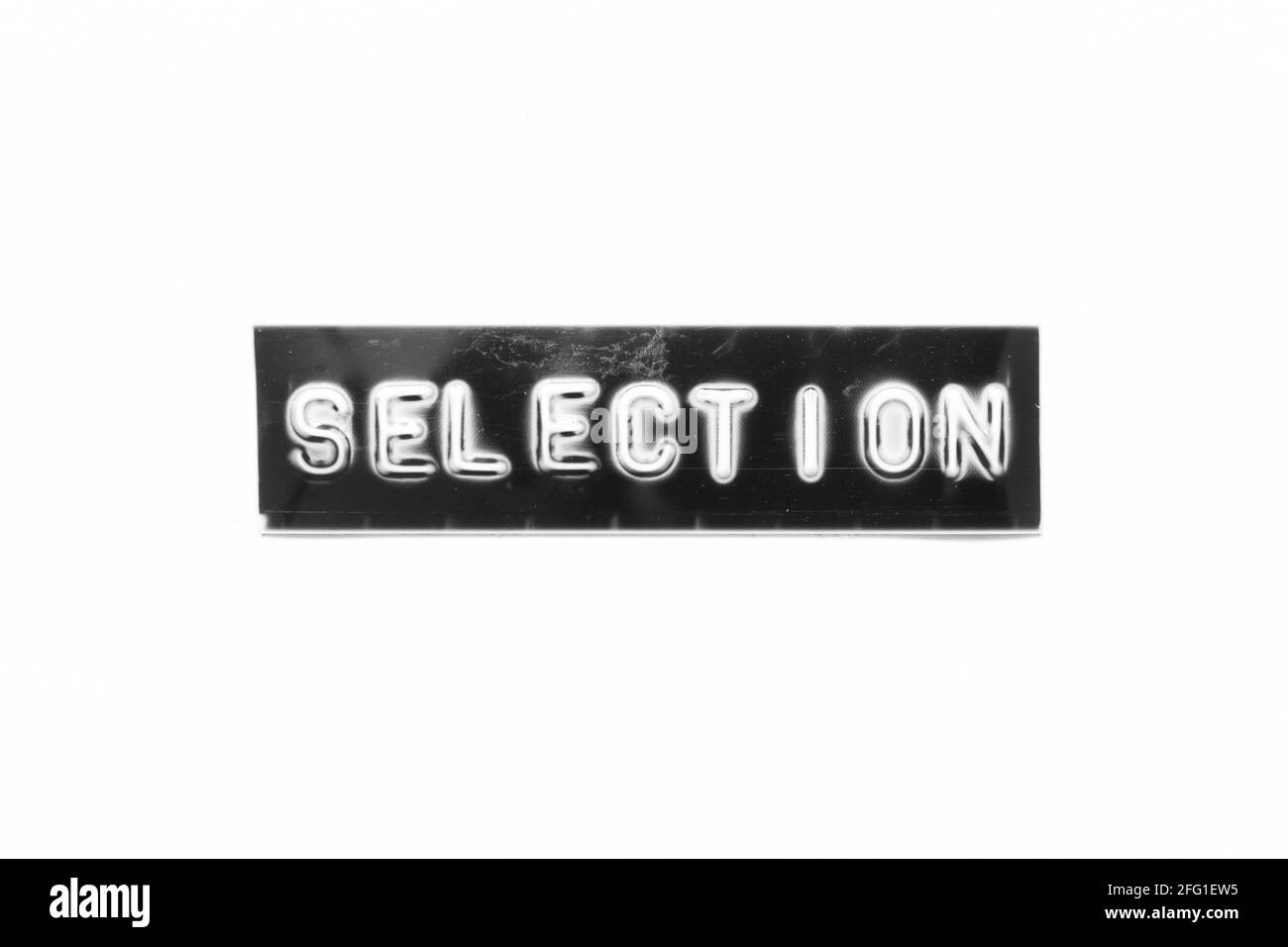 Embossed letter with word selection in black banner on white paper ...