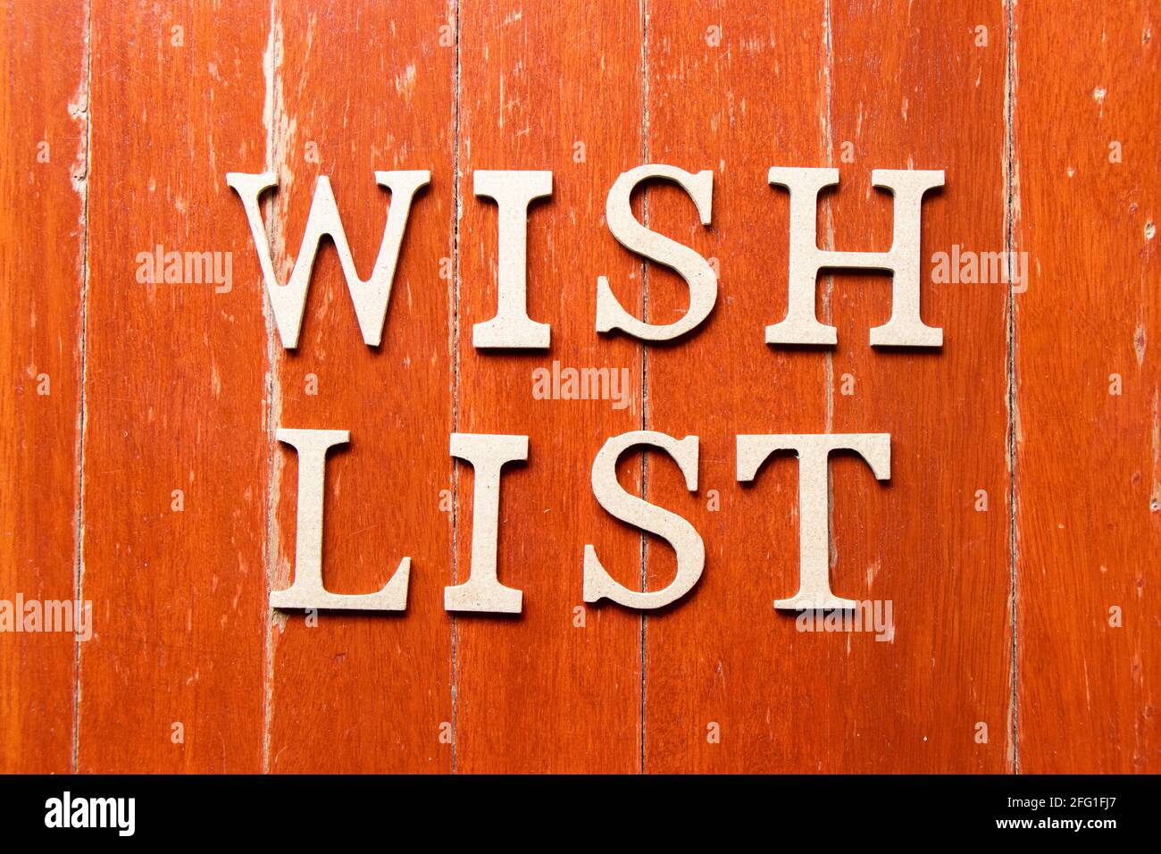 Alphabet letter in word wish list on old red color wood plate ...