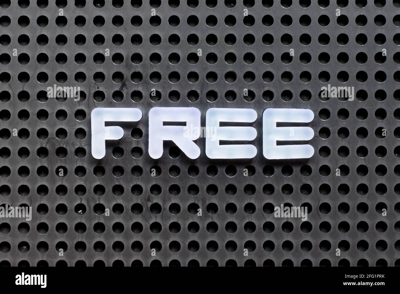 White color letter in word free on black pegboard background Stock ...