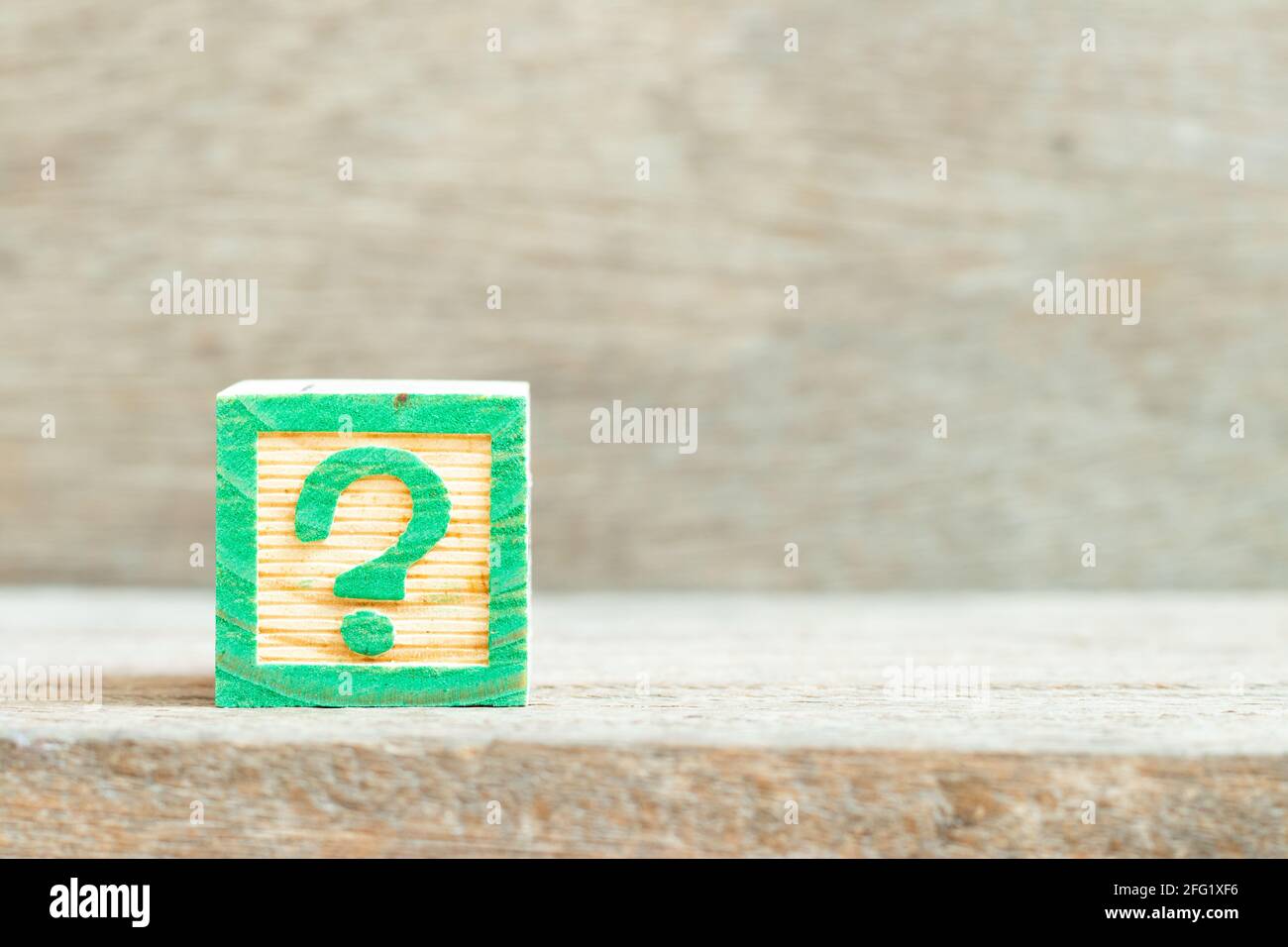 Color alphabet letter block in word question mark on wood background ...