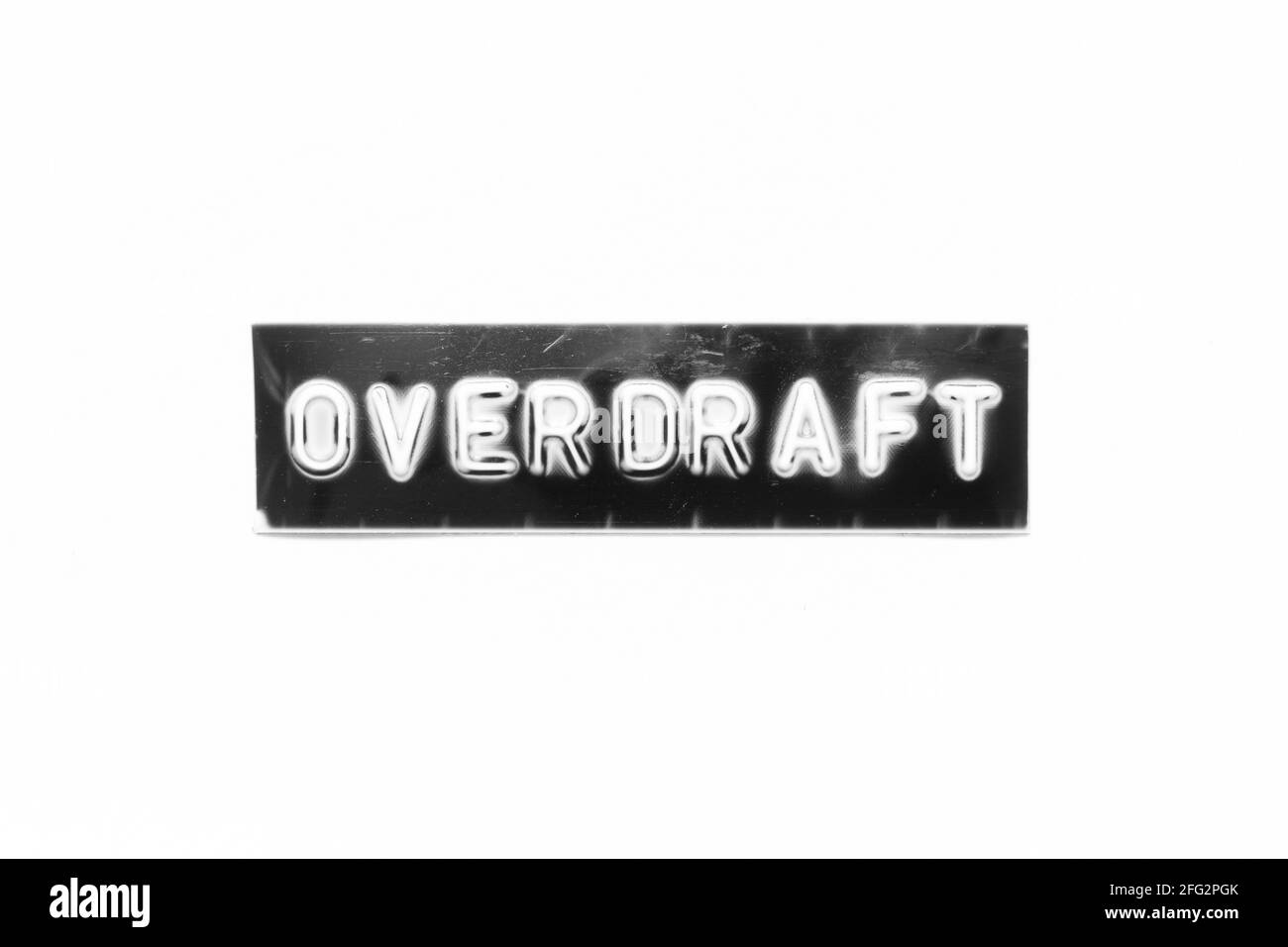 Embossed letter with word overdraft in black banner on white paper ...