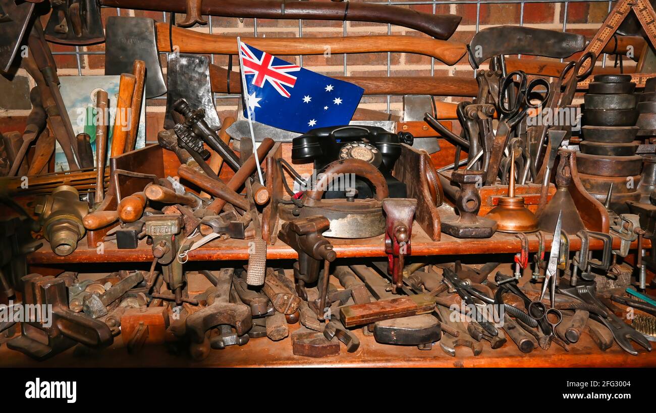 Assortment of old tools and axes on workbench Stock Photo - Alamy