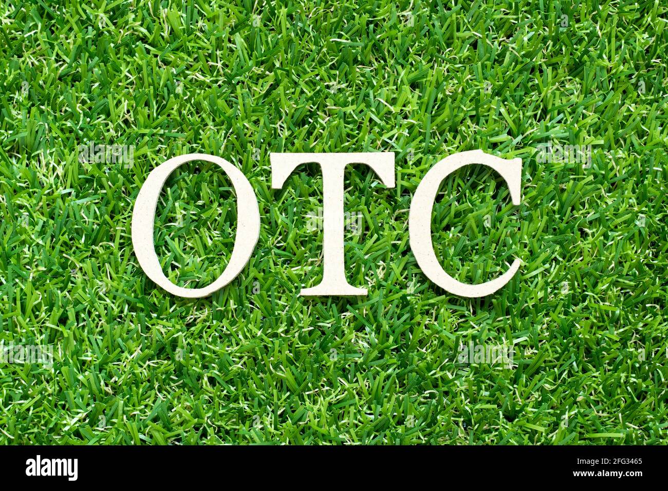 Alphabet letter in word OTC (Abbreviation of over the counter) on green ...
