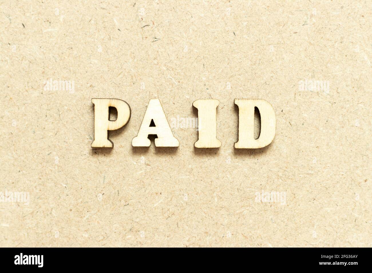 Alphabet letter in word paid on wood background Stock Photo - Alamy