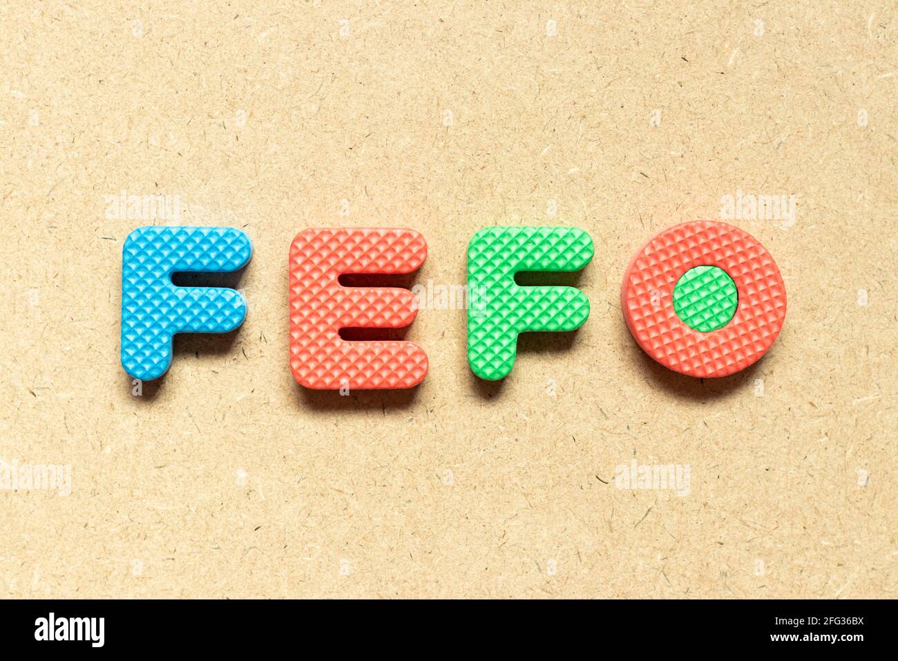Foam alphabet letter in word FEFO (Abbreviation of first expired first ...