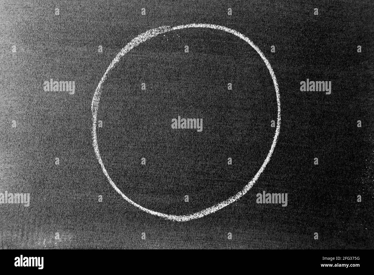White chalk hand drawing as circle shape on blackboard or chalkboard ...
