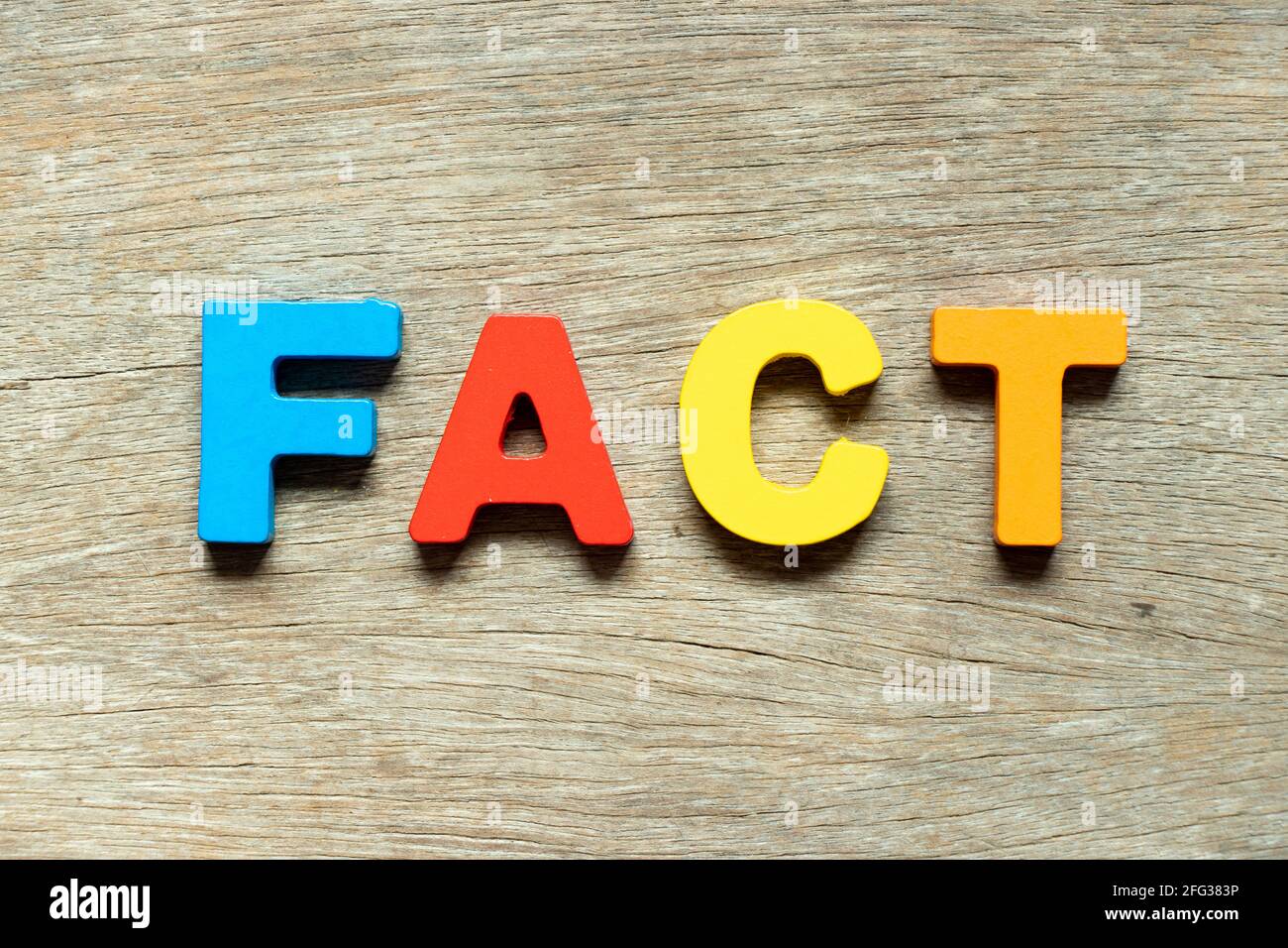 Color alphabet letter in word fact on wood background Stock Photo - Alamy