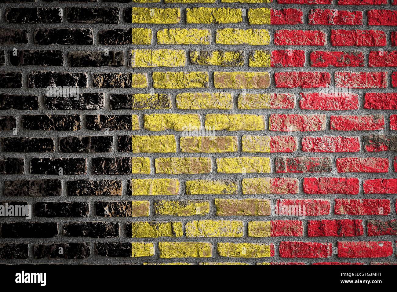 National flag of Belgium depicting in paint colors on an old brick wall ...