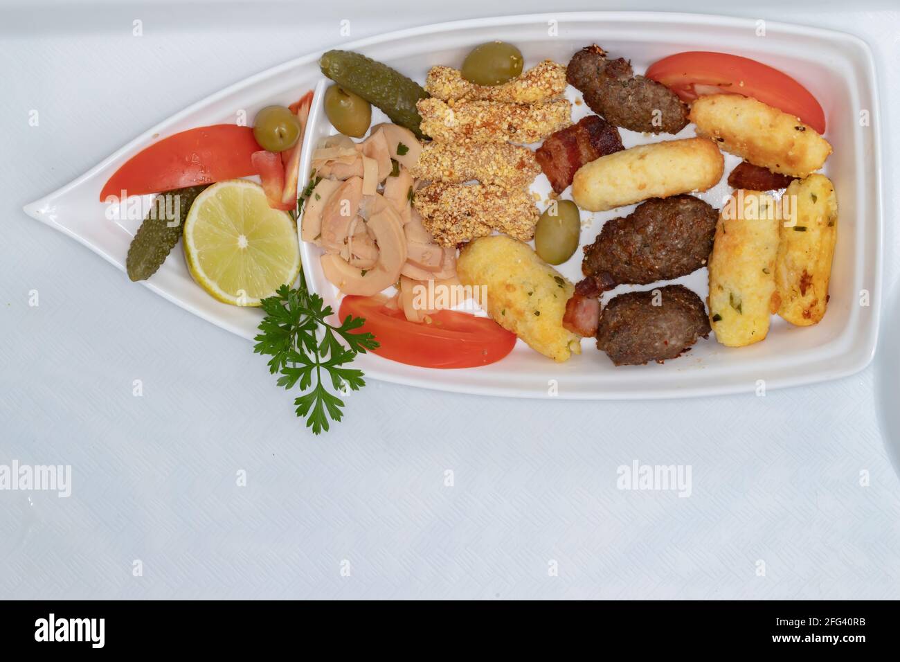Food mix of various ingredients including rice balls meat balls ...