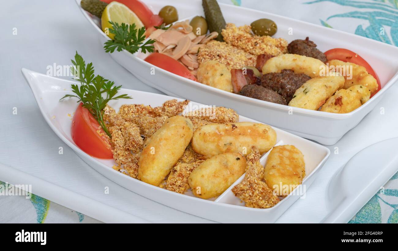 Food mix of various ingredients including rice balls meat balls ...