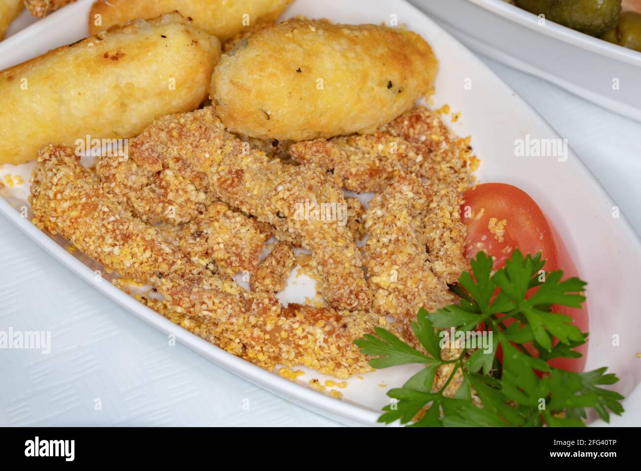 Food mix of various ingredients including rice balls meat balls ...