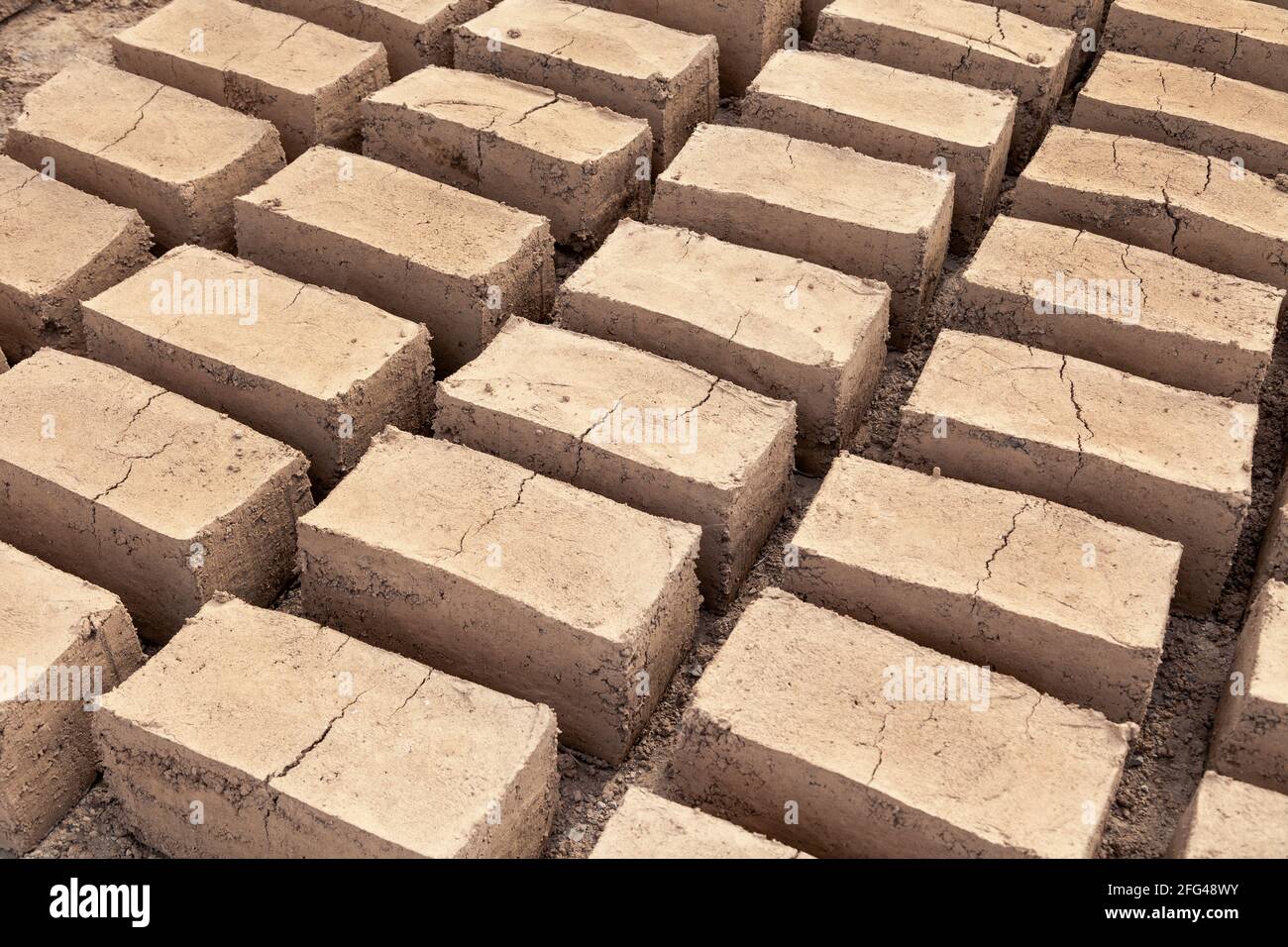 Production of clay brick in stacks, bricks are arranged on one by one ...