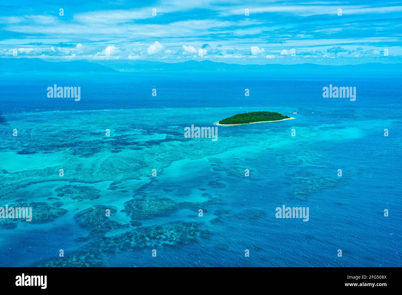 Bird's eye view of Green Island and Arlington Reef from a helicopter ...