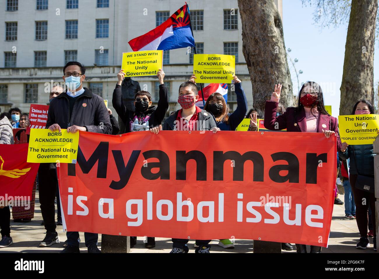 Protesters hold a banner and placards expressing their opinion during a ...