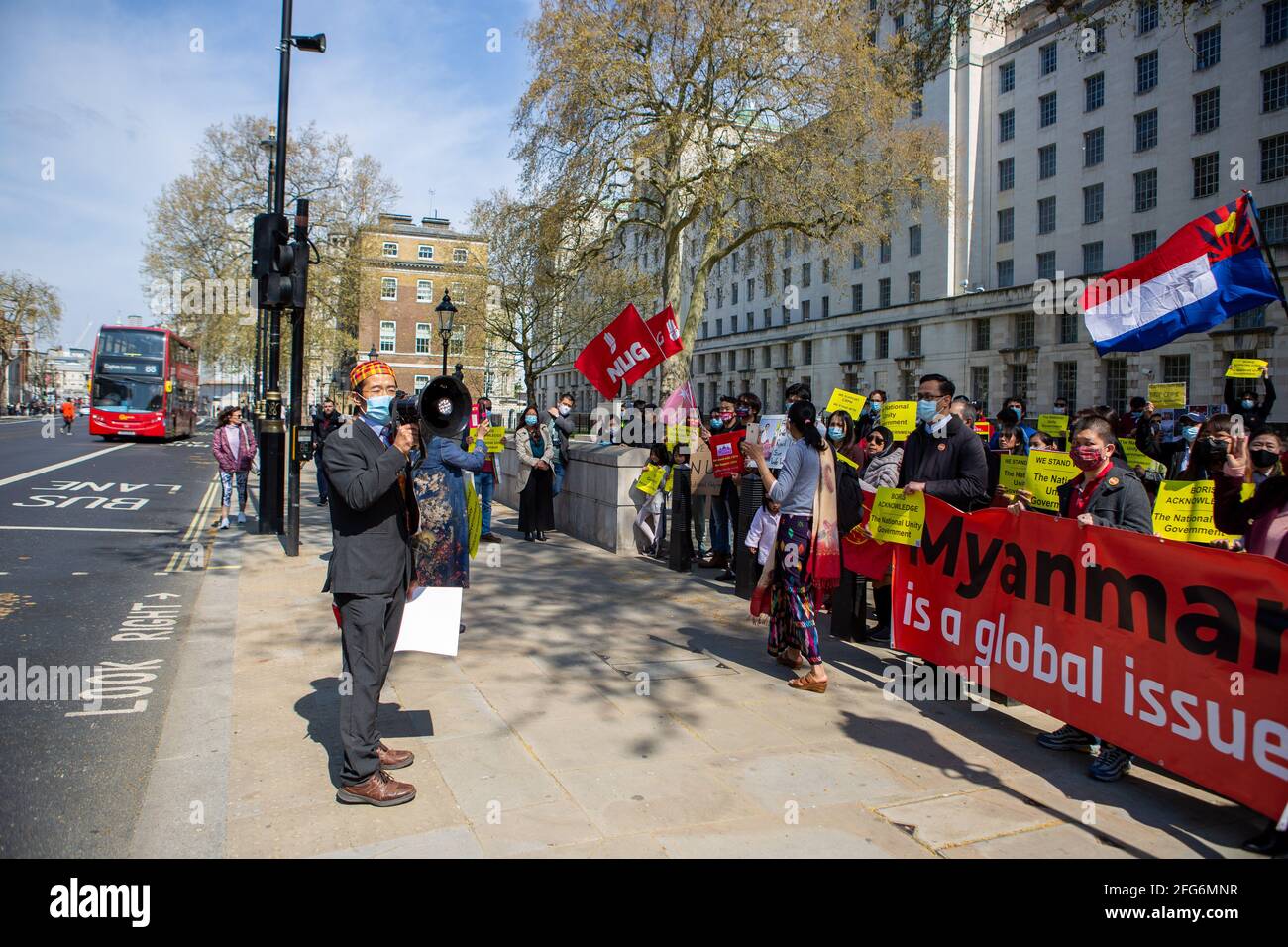 Protesters hold a banner and placards expressing their opinion during a ...