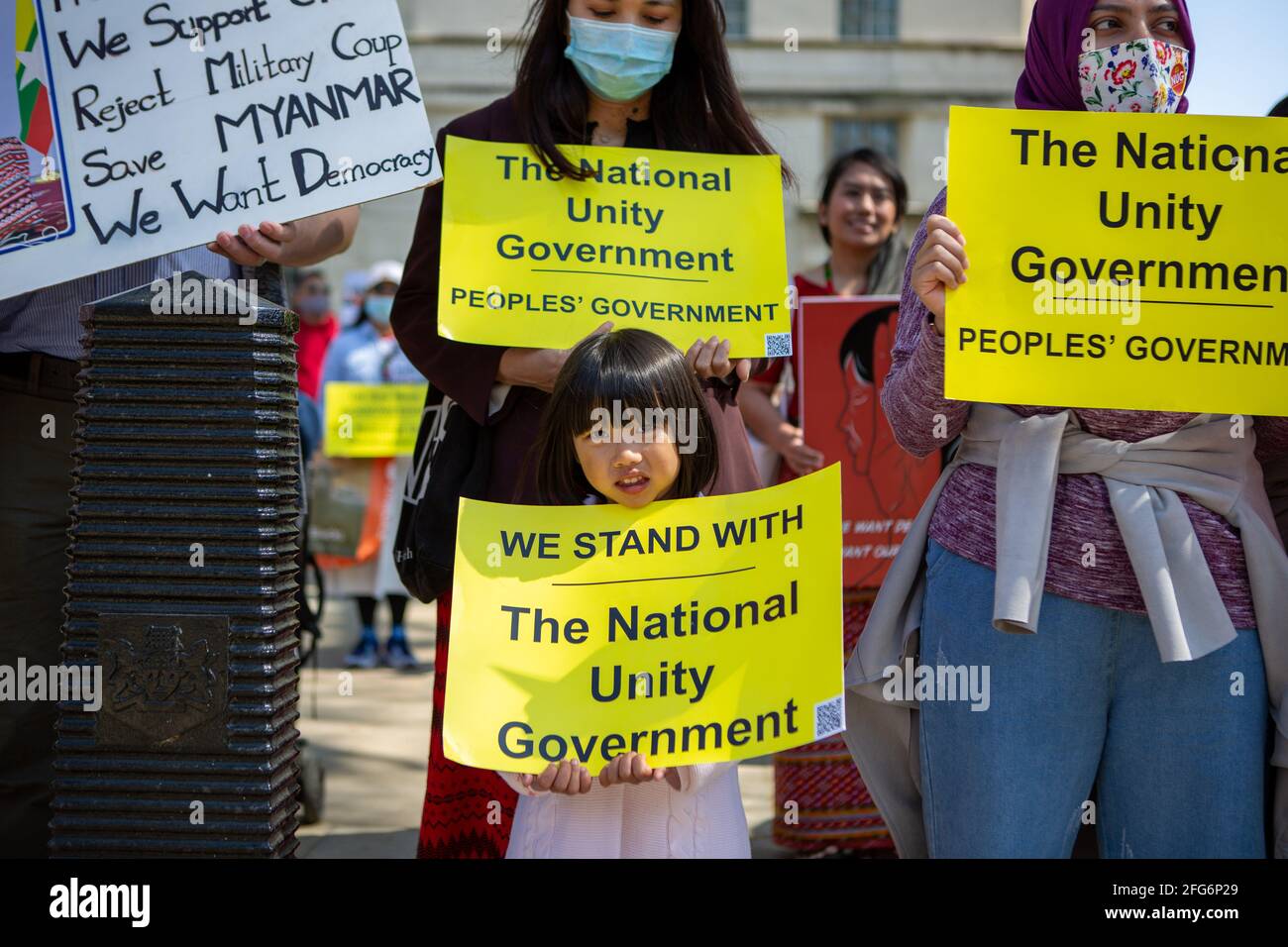 Protesters hold placards expressing their opinion during a peaceful ...