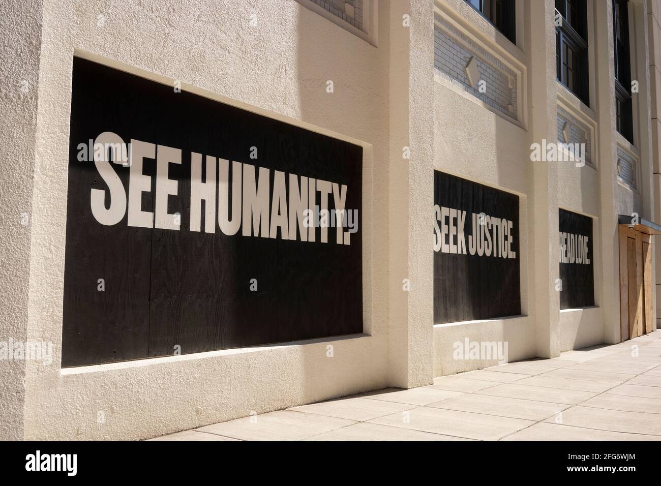 Positive slogans are seen on boarded-up windows of the Multnomah County ...