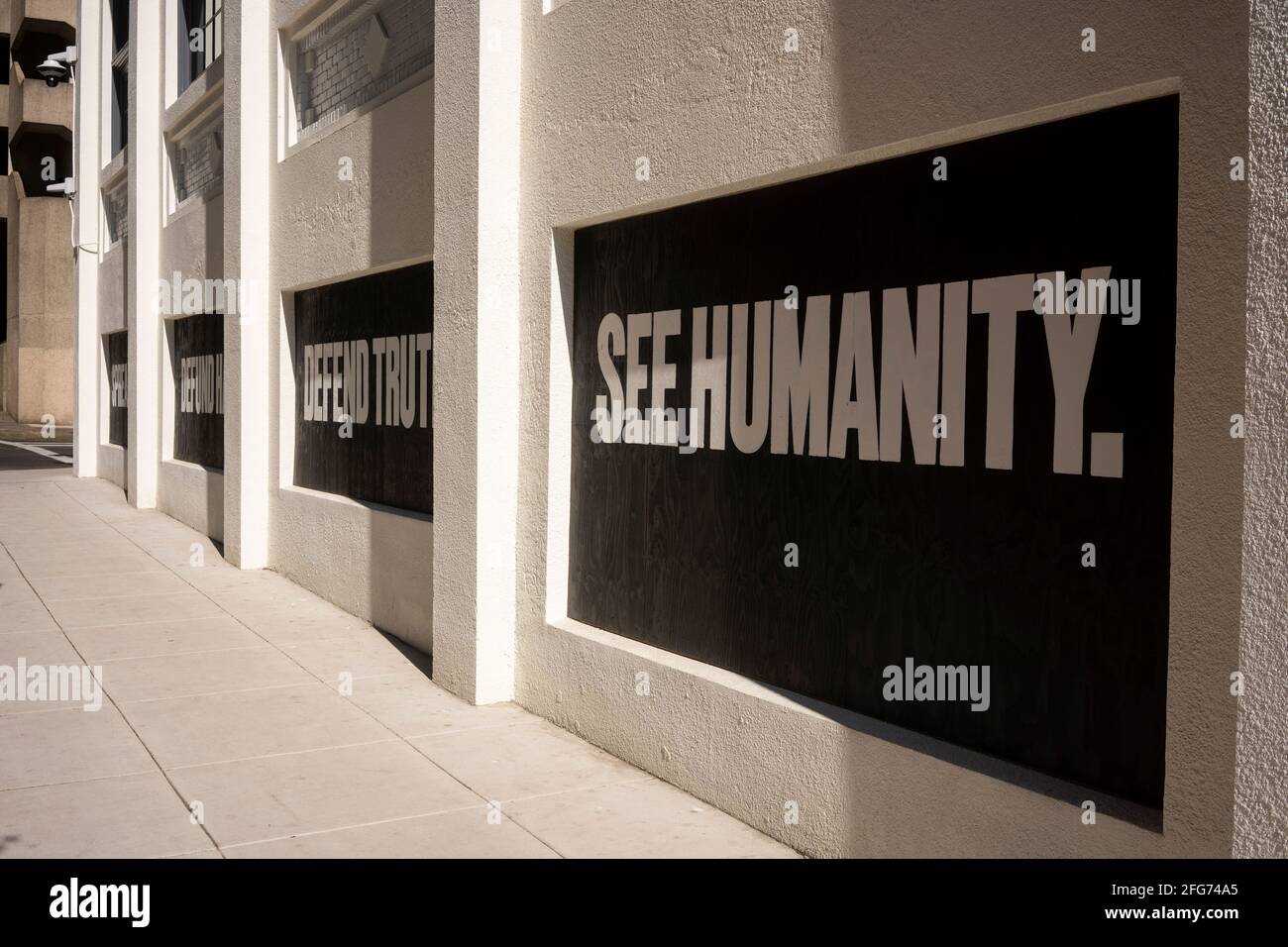 Positive slogans are seen on boarded-up windows of the Multnomah County ...