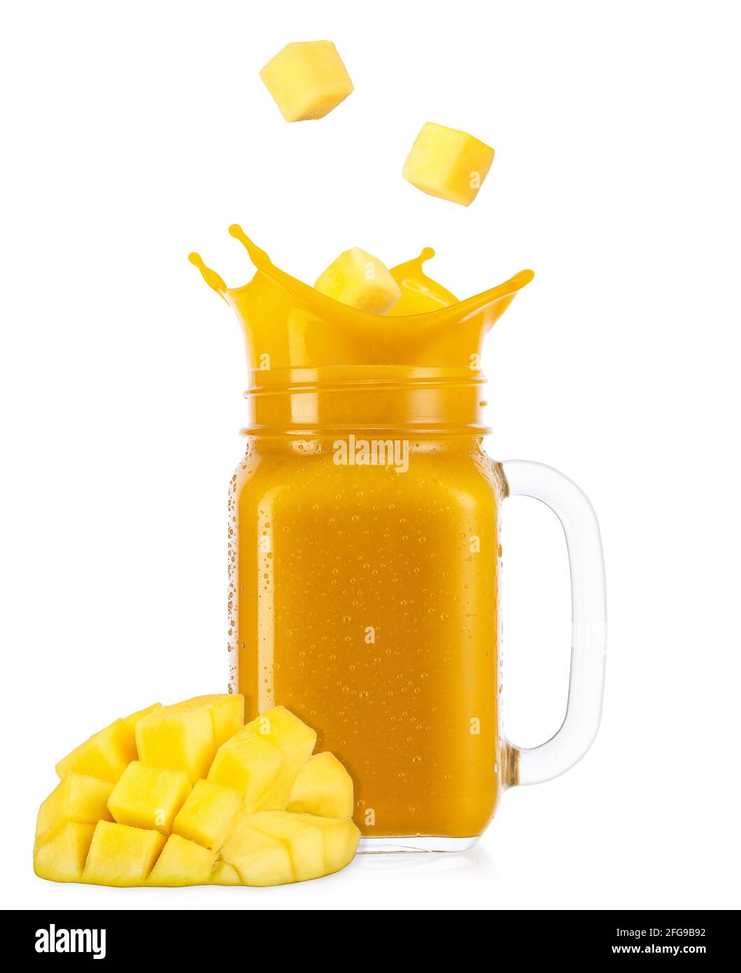 glass of splashing mango smoothie isolated on white Stock Photo - Alamy