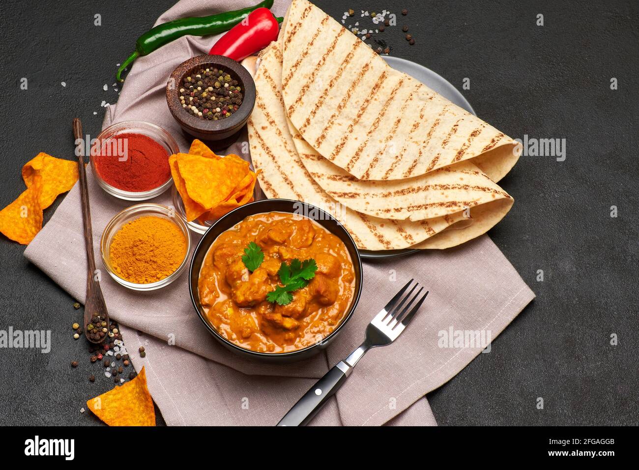 Plate of Traditional Chicken Curry and rice on dark concrete background ...