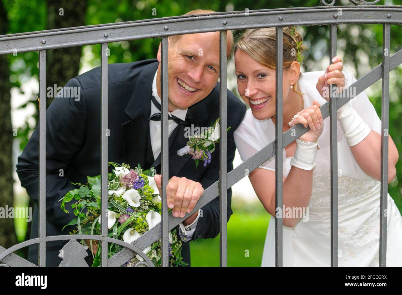 Good-humoured bridal couple on the day of the wedding Stock Photo - Alamy