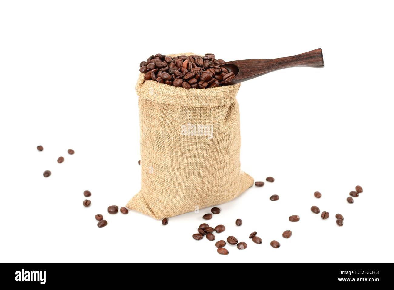 Coffee beans. Jute burlack sack with roasted coffee beans and coffee spatula in it. Isolated on ...