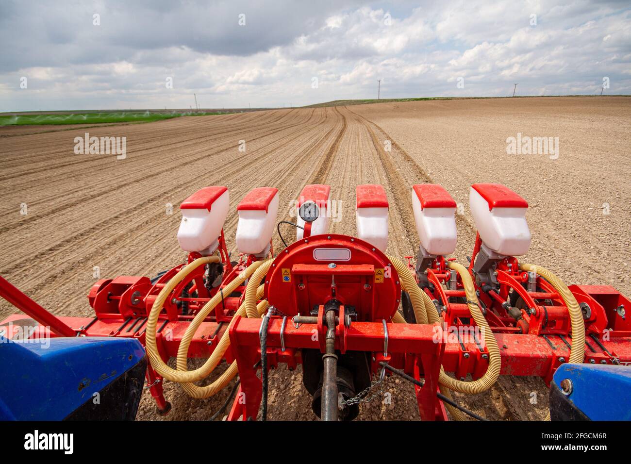 tractor sowing of seed to field at spring time Stock Photo - Alamy