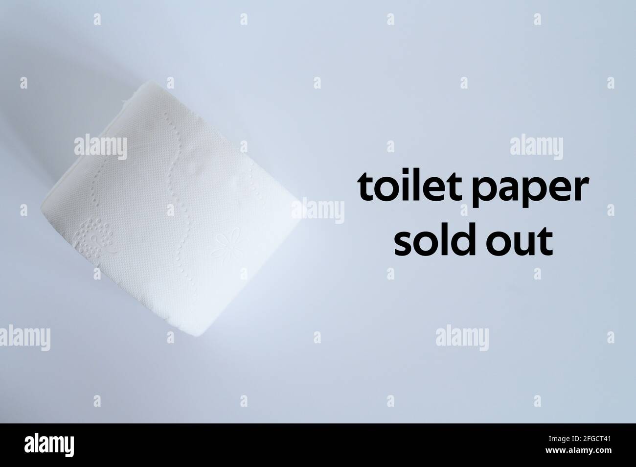 rolled white toilet paper on a white background and text toilet paper ...
