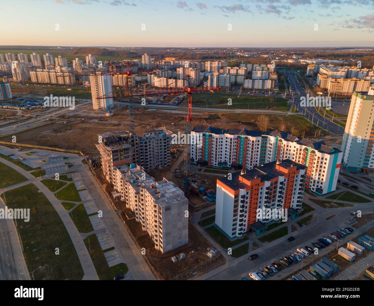 Construction site at dawn. Claimed multi-storey houses are visible ...