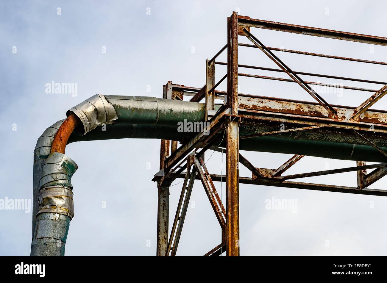 Abandoned industrial complex, rusted and broken pipes and construction ...