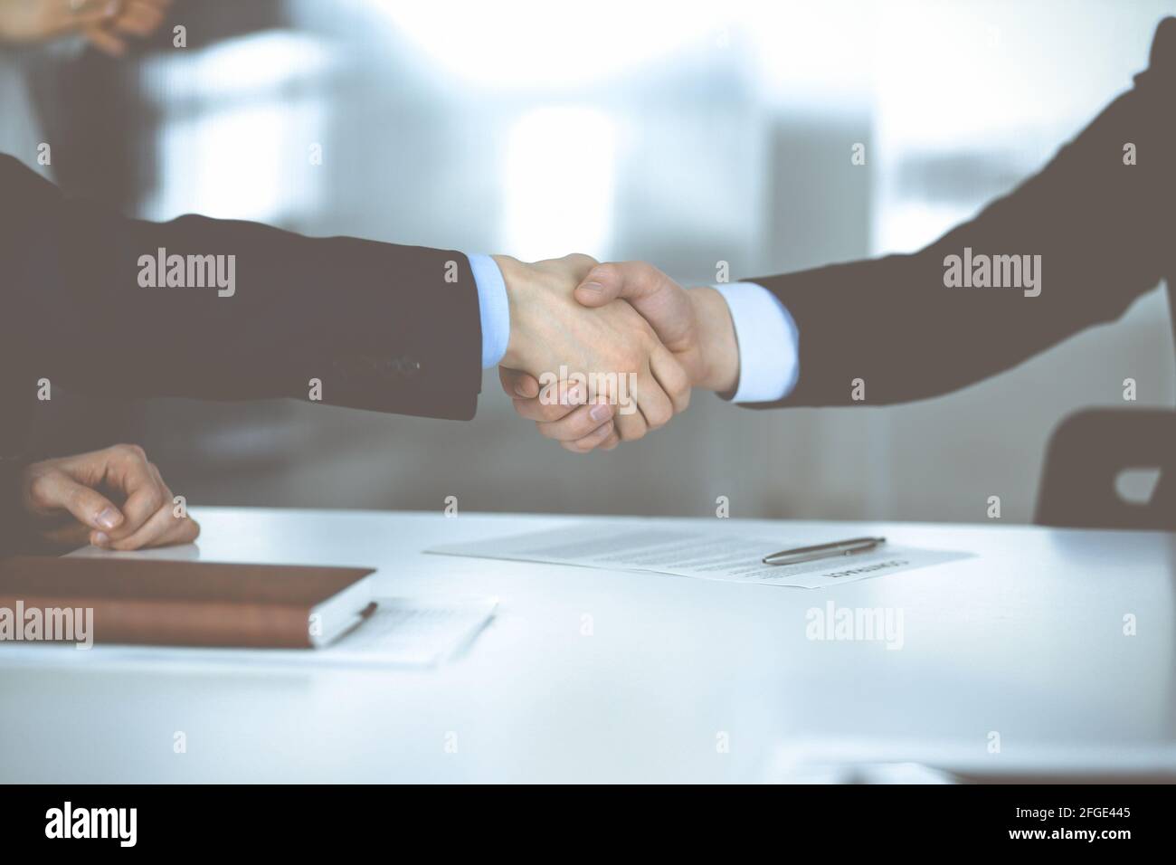 Business people shaking hands at meeting or negotiation, close-up ...