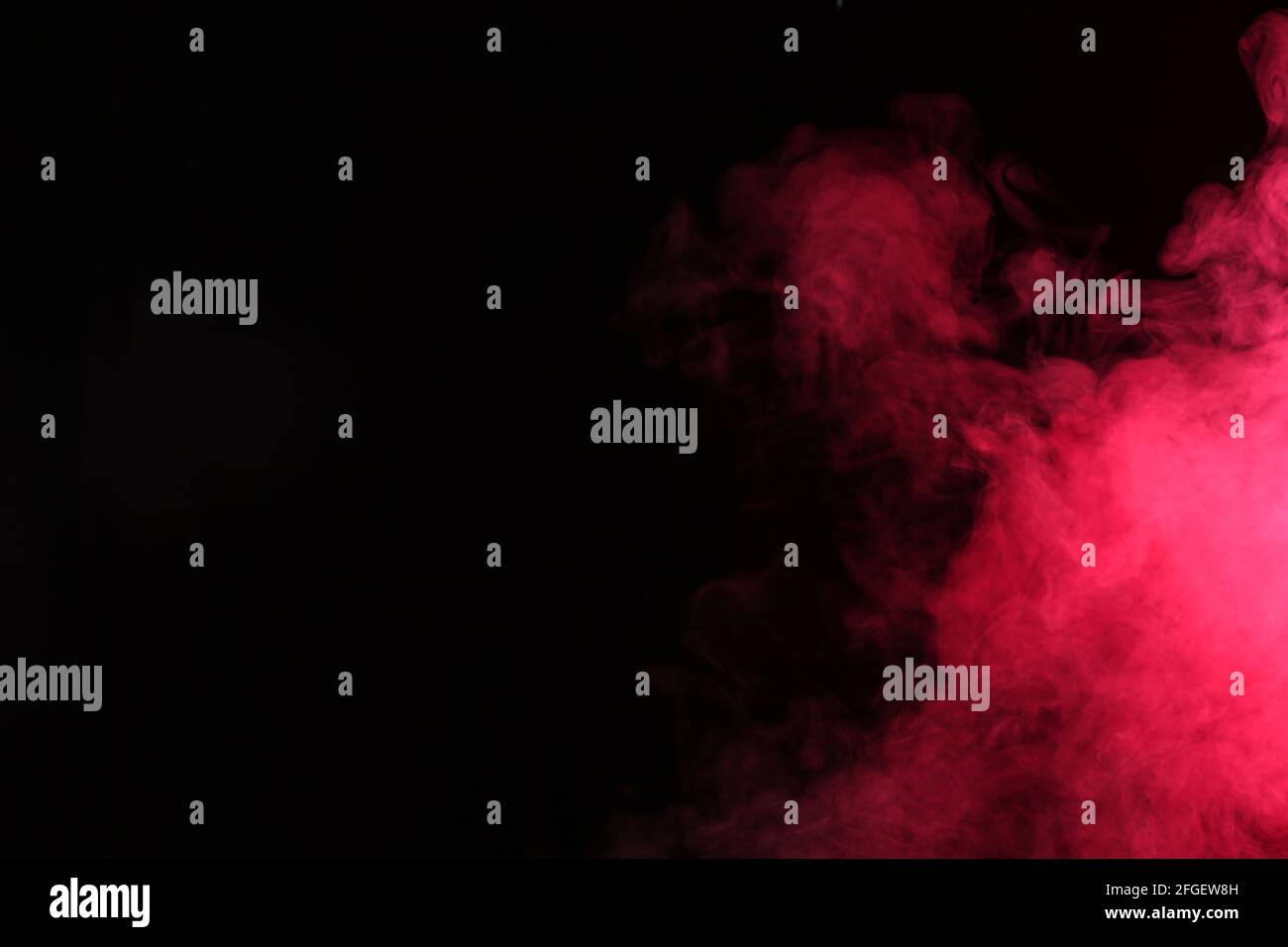 Smoke in red light on black background Stock Photo - Alamy