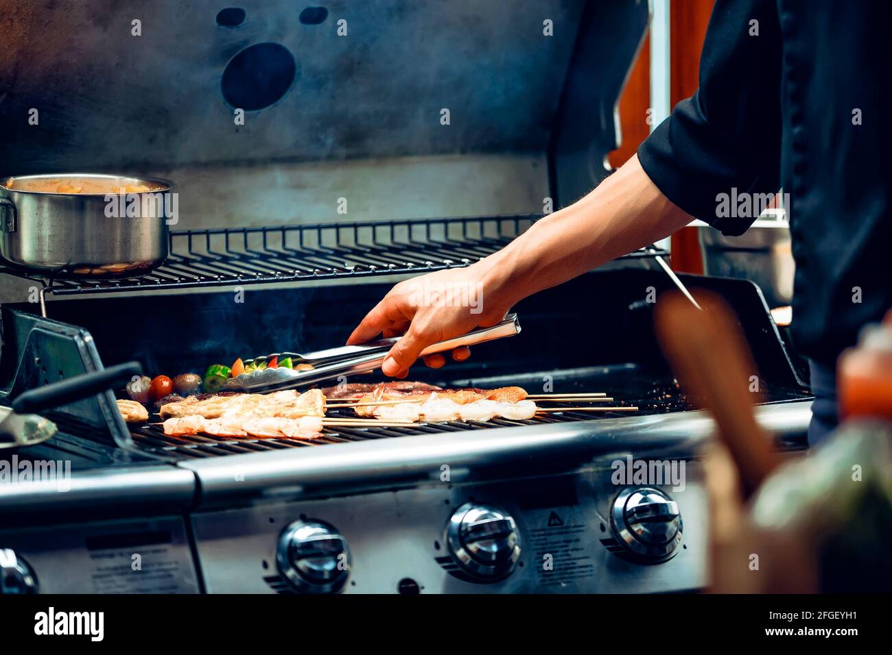 Man cooking roast chicken hi-res stock photography and images - Alamy