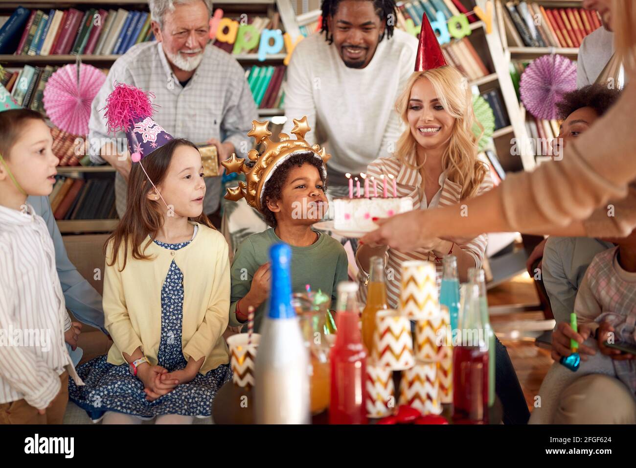 Family generations celebrating a kids birthday in a festive atmosphere ...