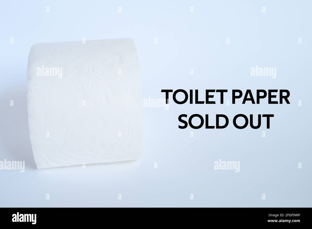 rolled white toilet paper on a white background and text toilet paper ...