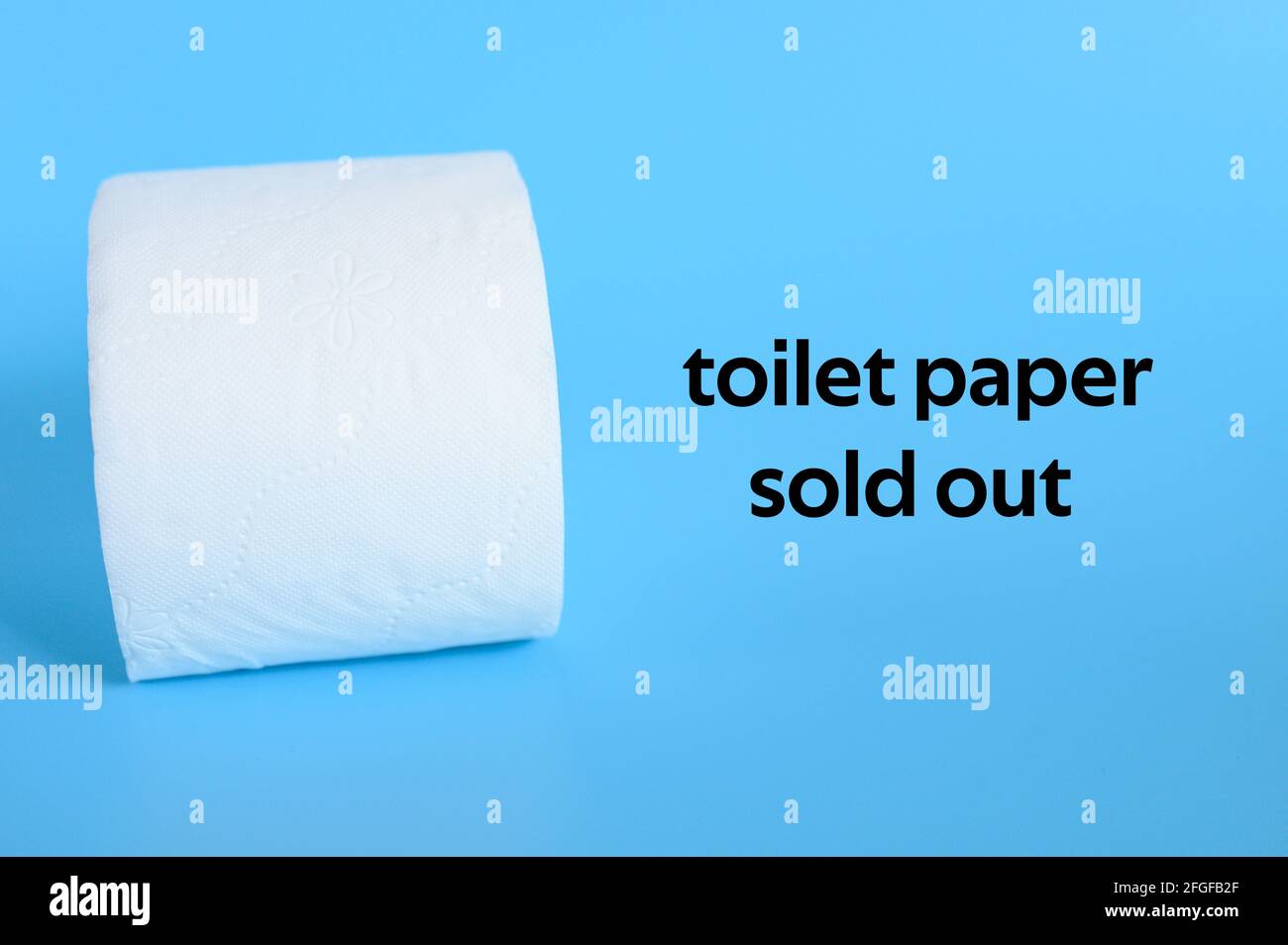 rolled white toilet paper on a blue background and text toilet paper ...