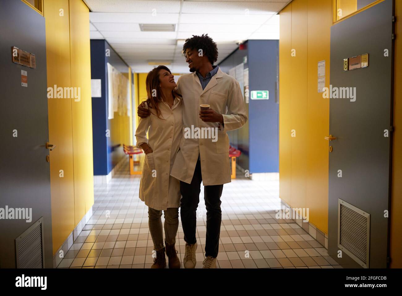 Student walking down hallway hi-res stock photography and images - Alamy