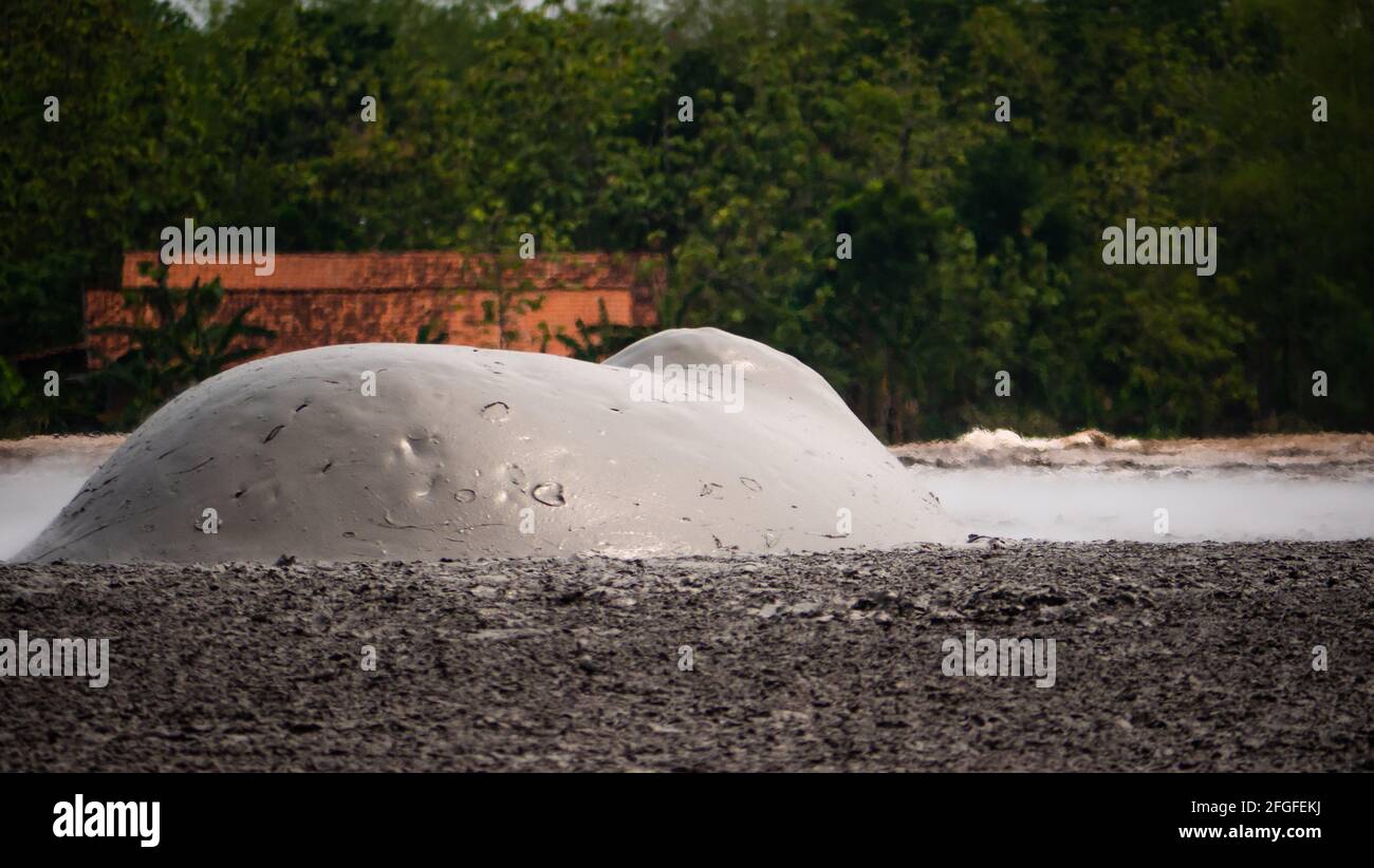 mud volcano with bursting bubble bledug kuwu. volcanic plateau with ...