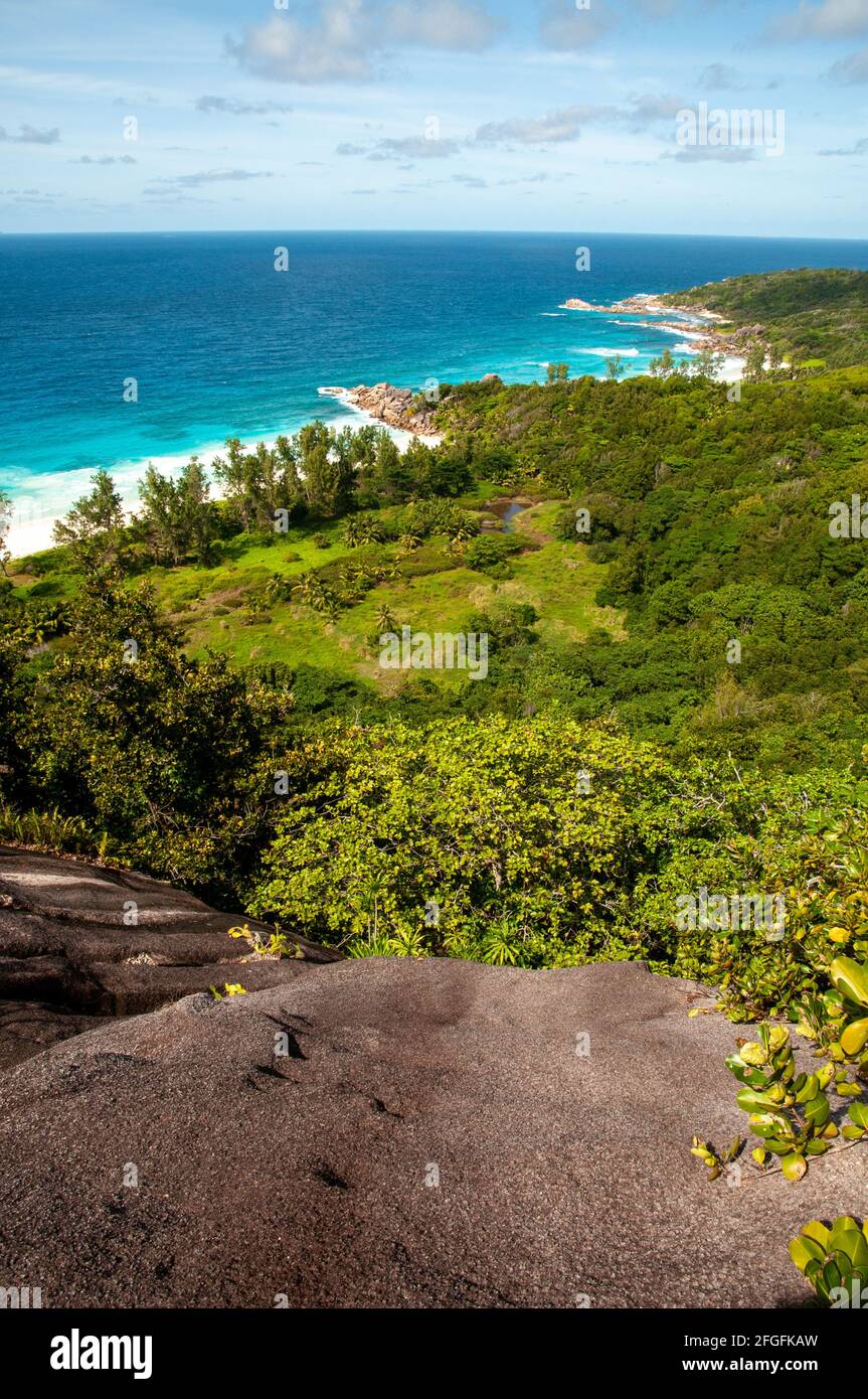 A mesmerizing view of the ocean and the green island gleaming under the ...
