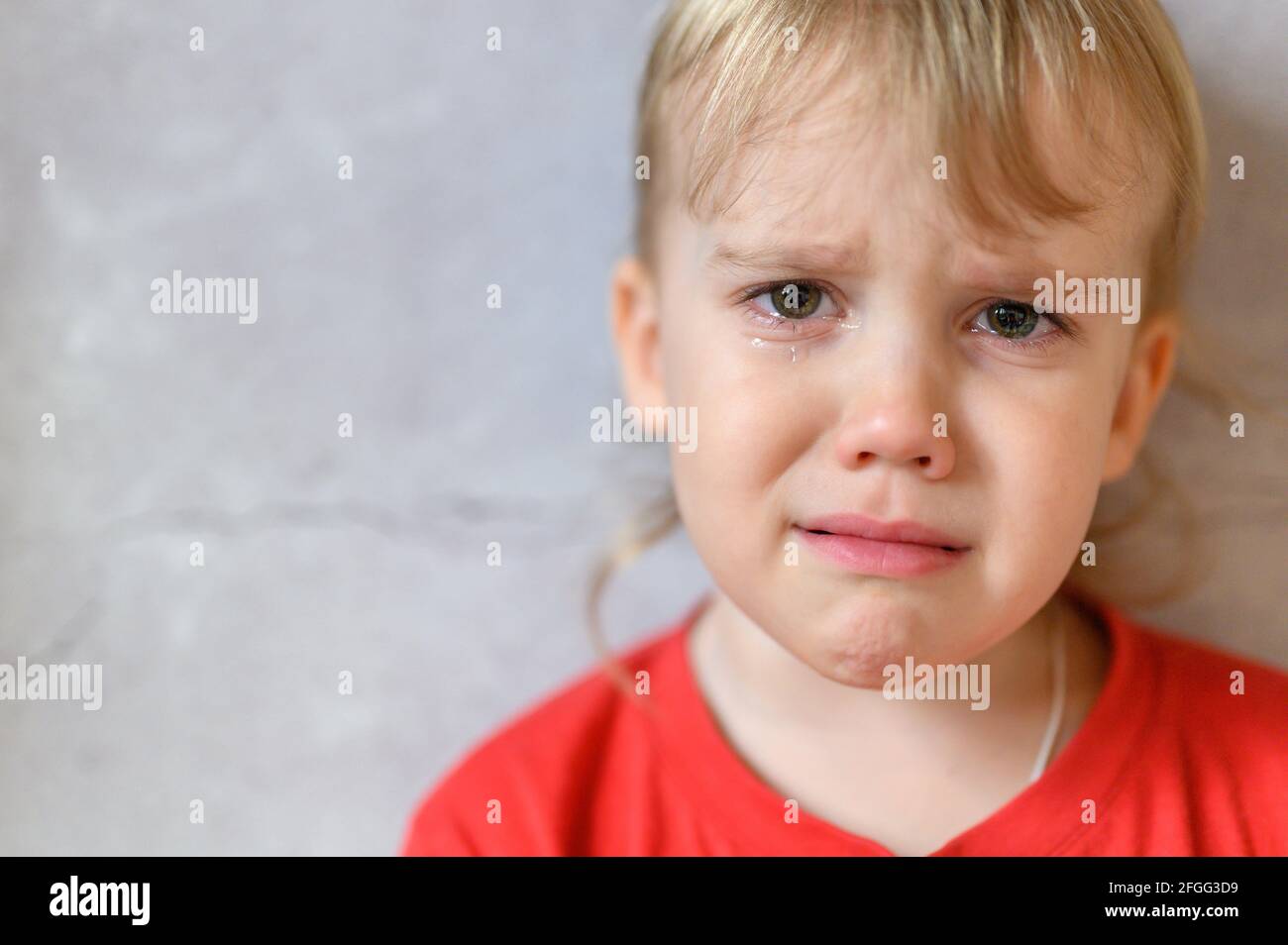 kid crying. the face of a cute little upset four year old baby boy in ...